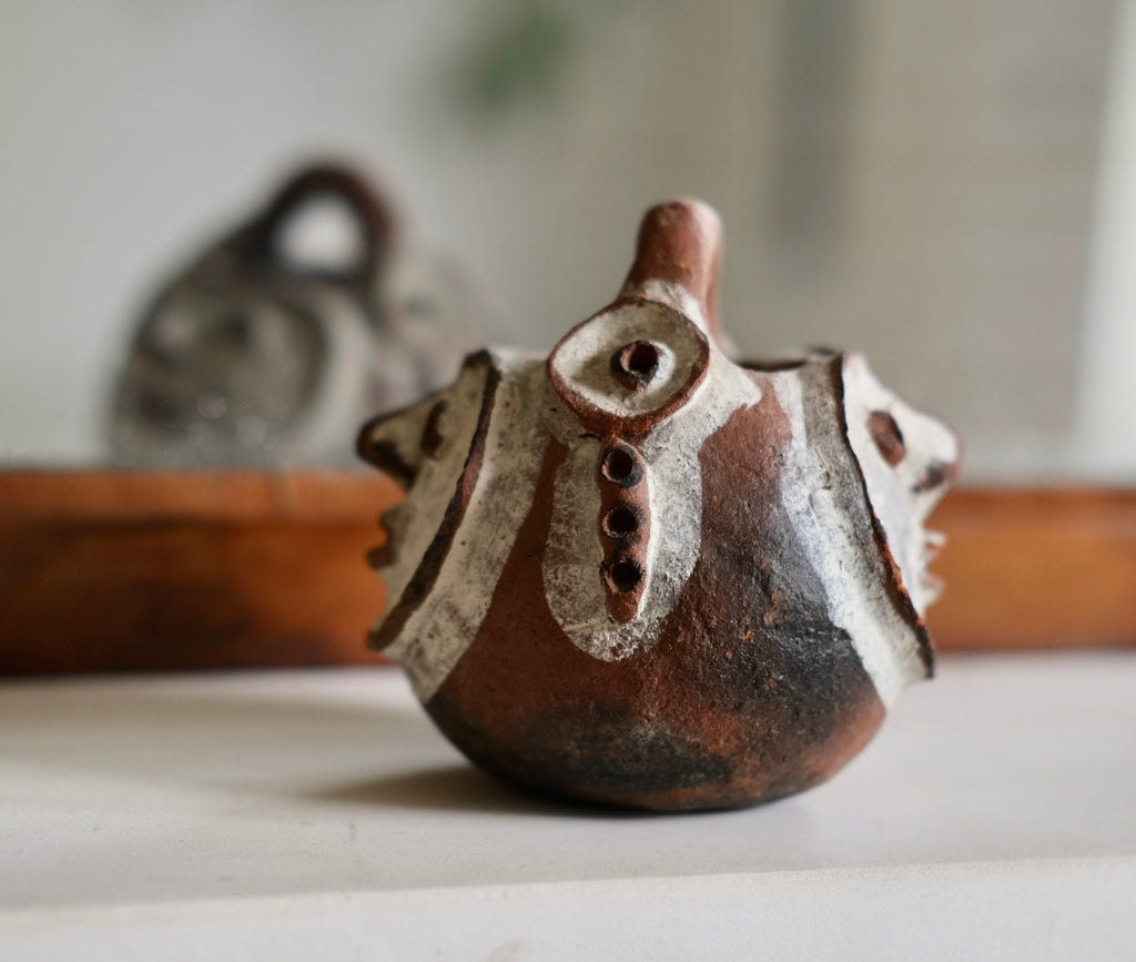 Anthropomorphic Terracotta Pot – punch the clock