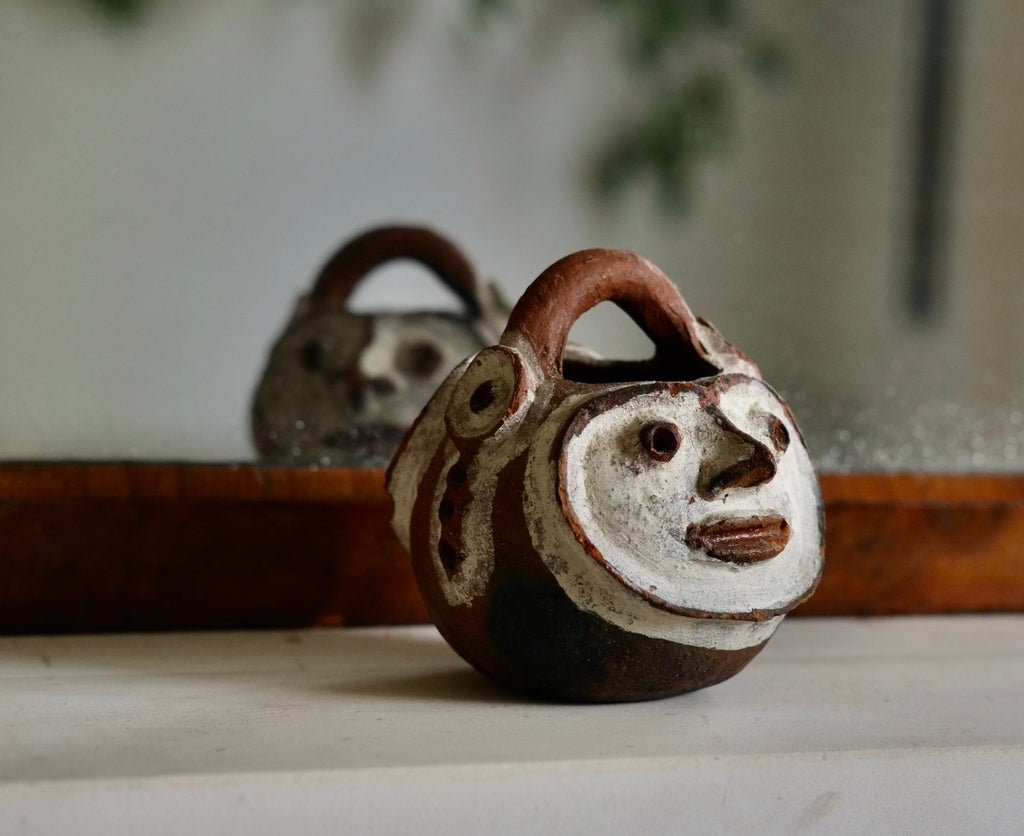 Anthropomorphic Terracotta Pot – punch the clock