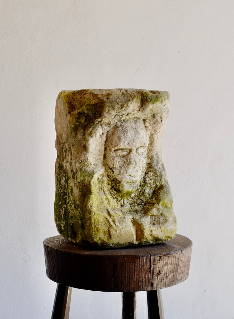 CELTIC CARVED LIMESTONE FACE – punch the clock